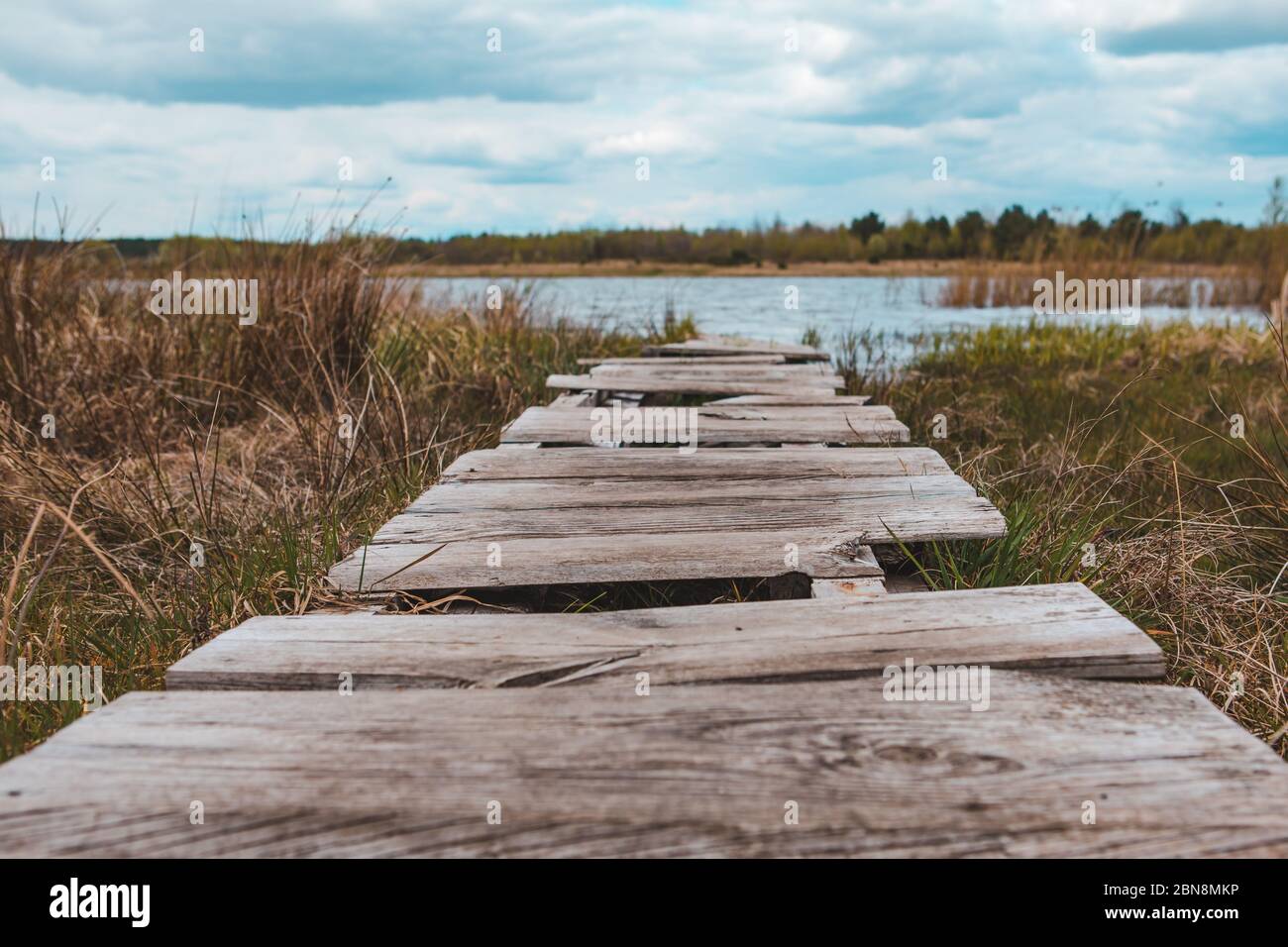 view of wooden old dock at lake beach Stock Photo - Alamy