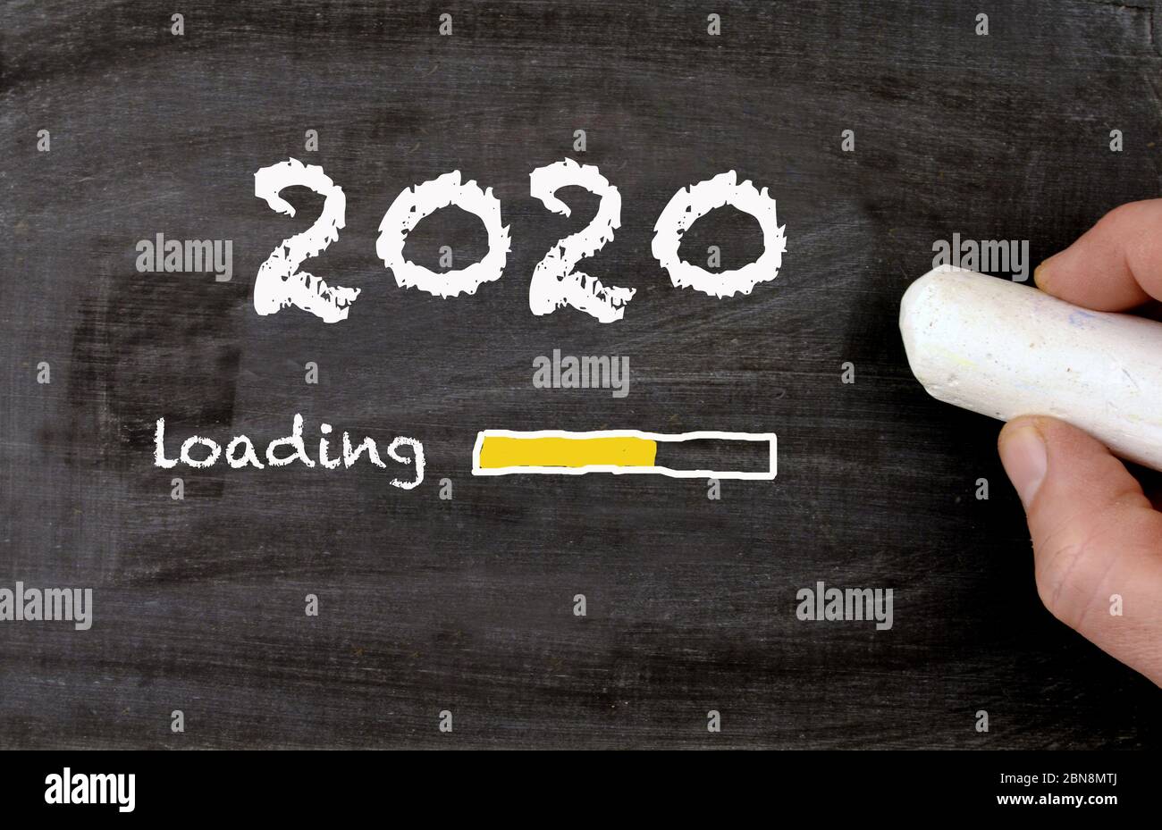 Chalkboard with 2020 design and loading sign Stock Photo - Alamy
