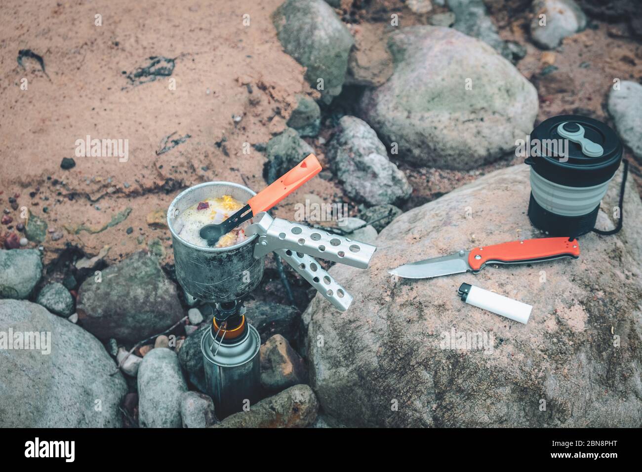 Cooking while hiking with a backpack Stock Photo - Alamy