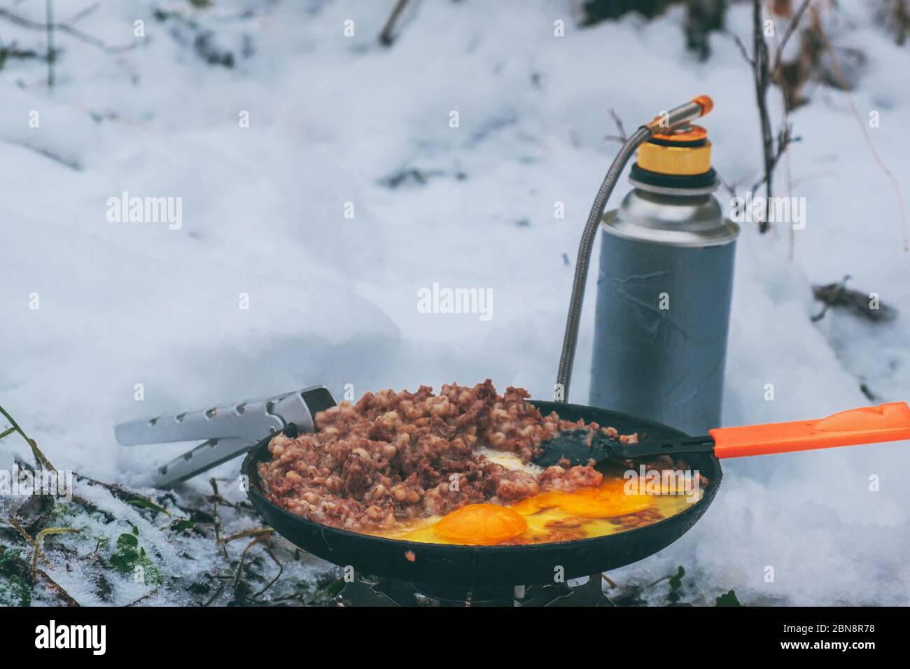 Cooking while hiking with a backpack Stock Photo - Alamy