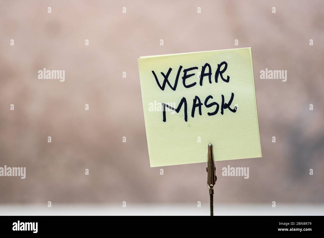Wear mask handwriting text on memo post reminder isolated with copy ...