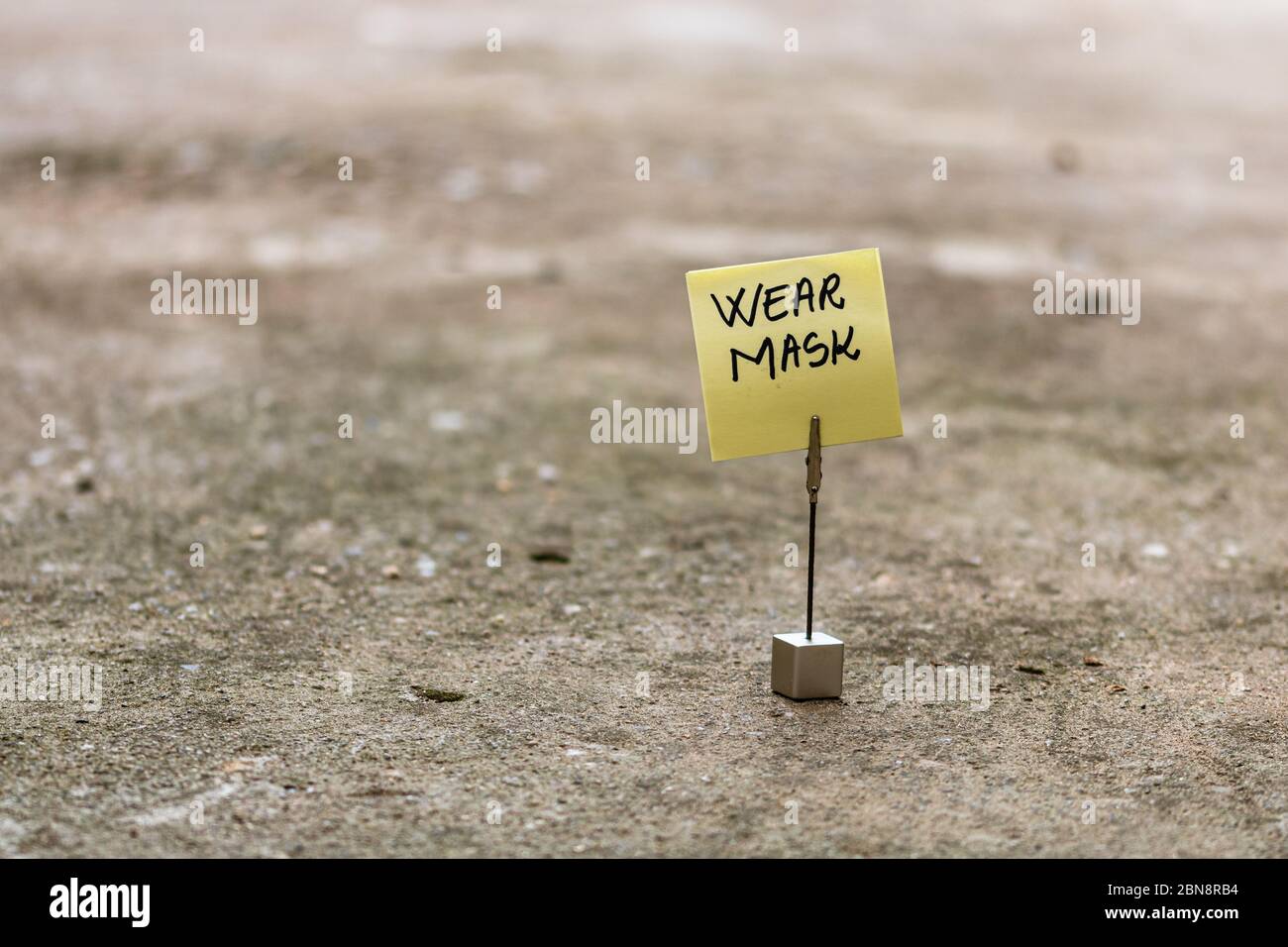 Wear mask handwriting text on memo post reminder isolated with copy ...