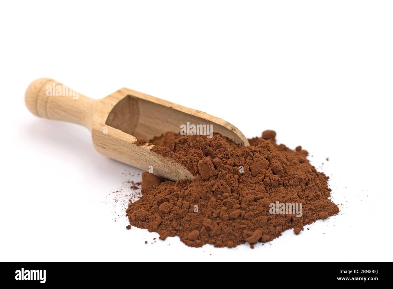 Cocoa powder on a spice scoop in front of white background Stock Photo ...