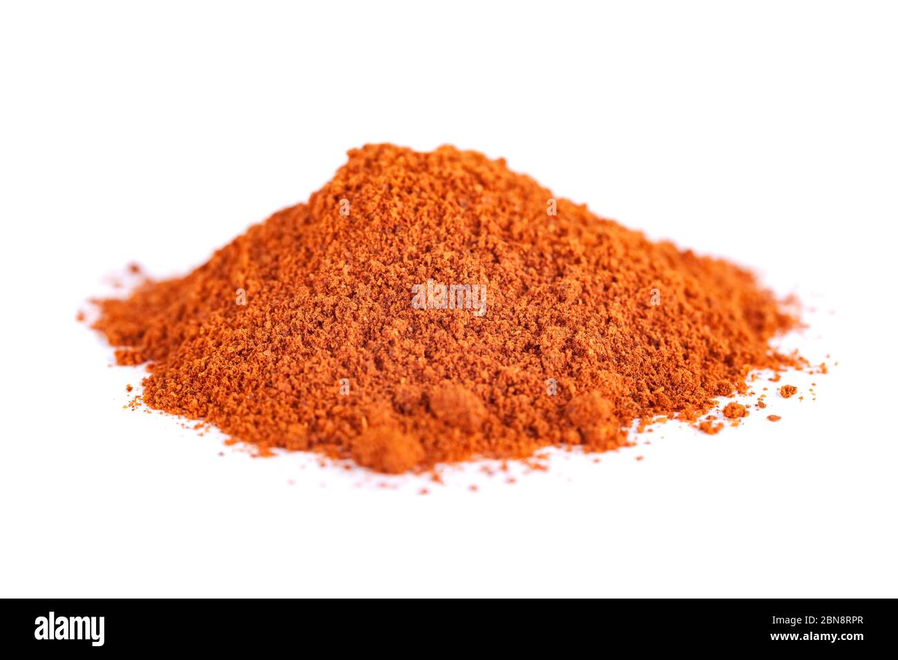 Heap of ground Red pepper isolated on white background Stock Photo - Alamy