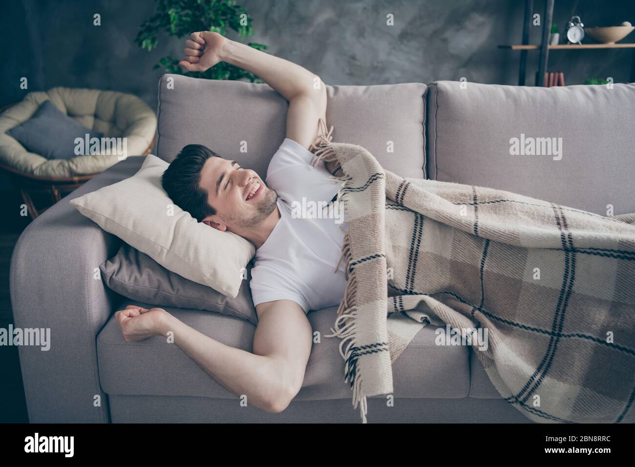 Portrait of his he nice attractive cheerful dreamy sleepy guy lying on ...