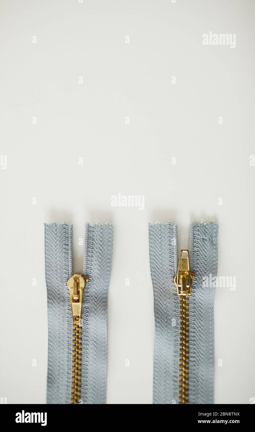 Close-up of two zippers isolated on white background Stock Photo - Alamy