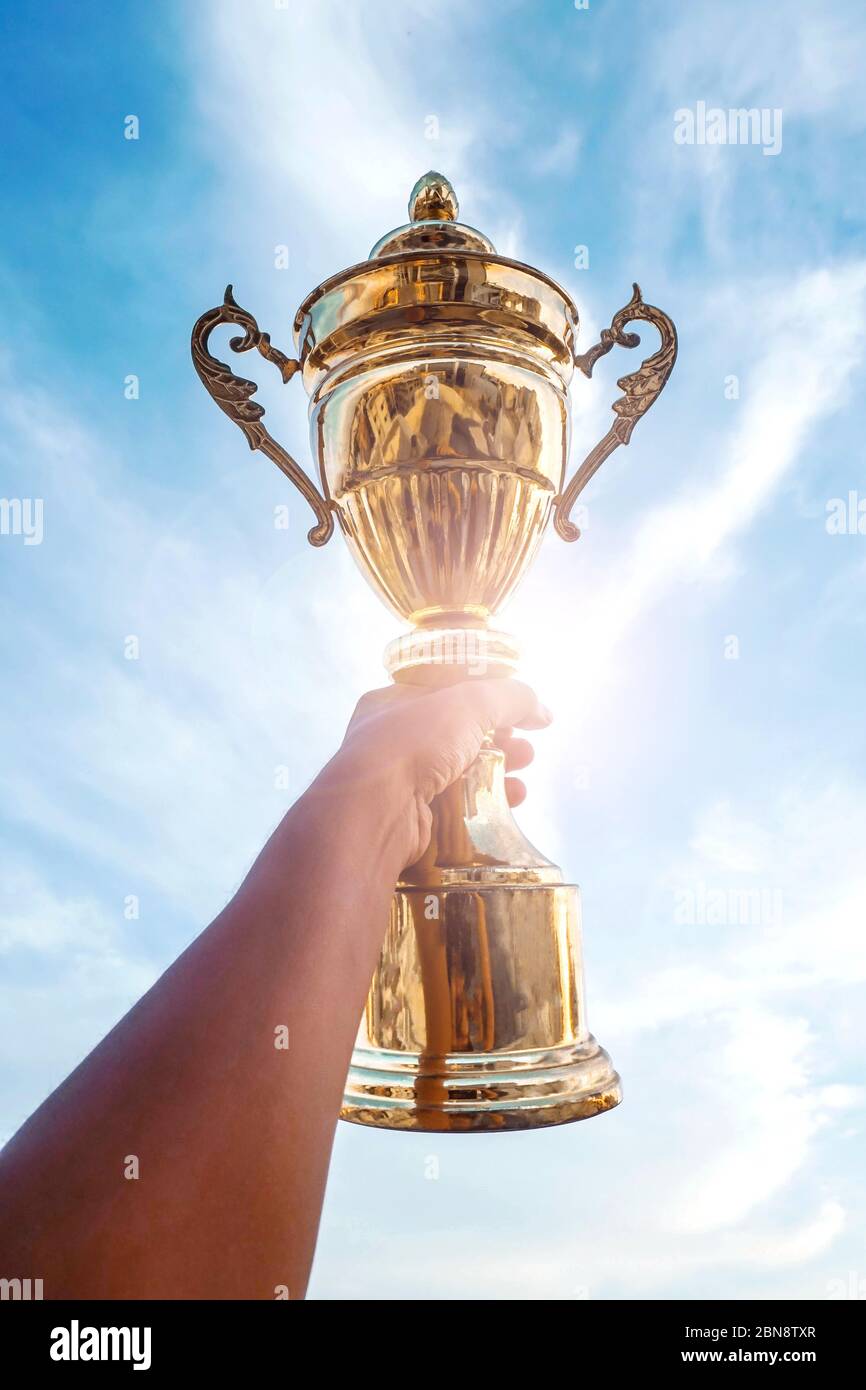 winner trophy on sky background Stock Photo - Alamy
