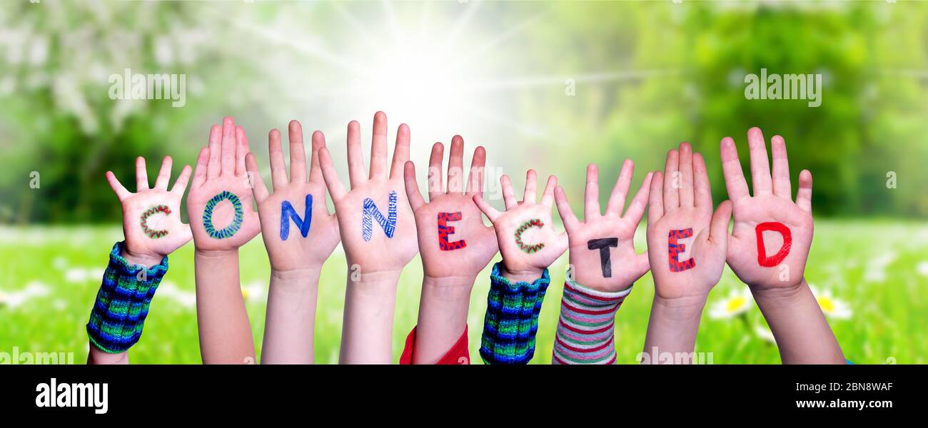 Children Hands Building Word Connected, Grass Meadow Stock Photo - Alamy