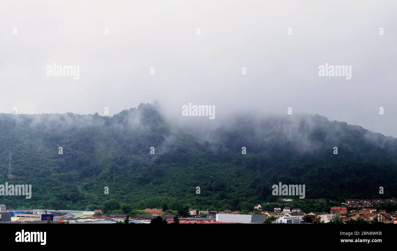 Mountains after rain. Evaporation, natural haze, heavy clouds on the ...