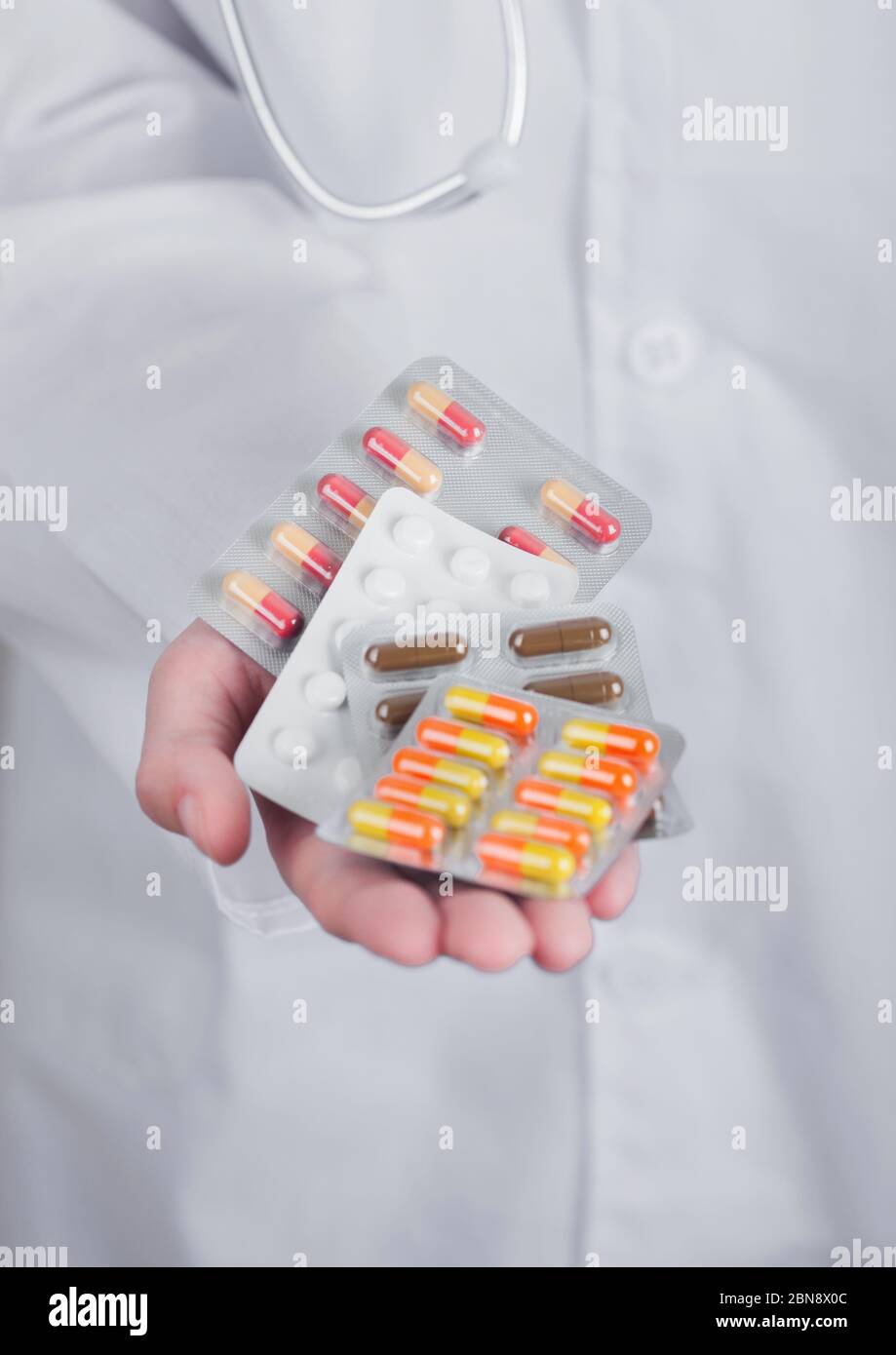 Hand holding stack of tablets hi-res stock photography and images - Alamy