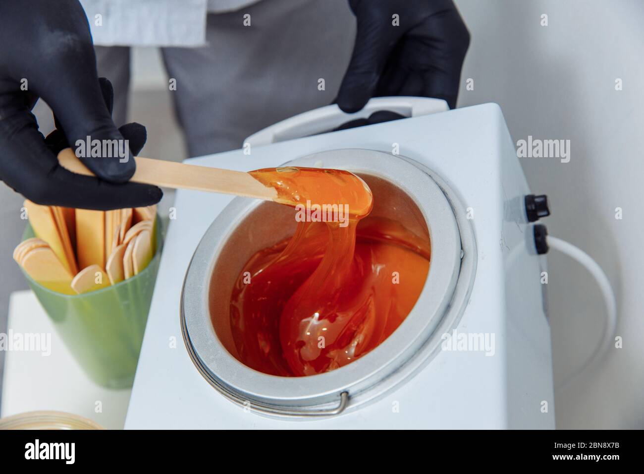 Melted wax waxing woman hi-res stock photography and images - Alamy