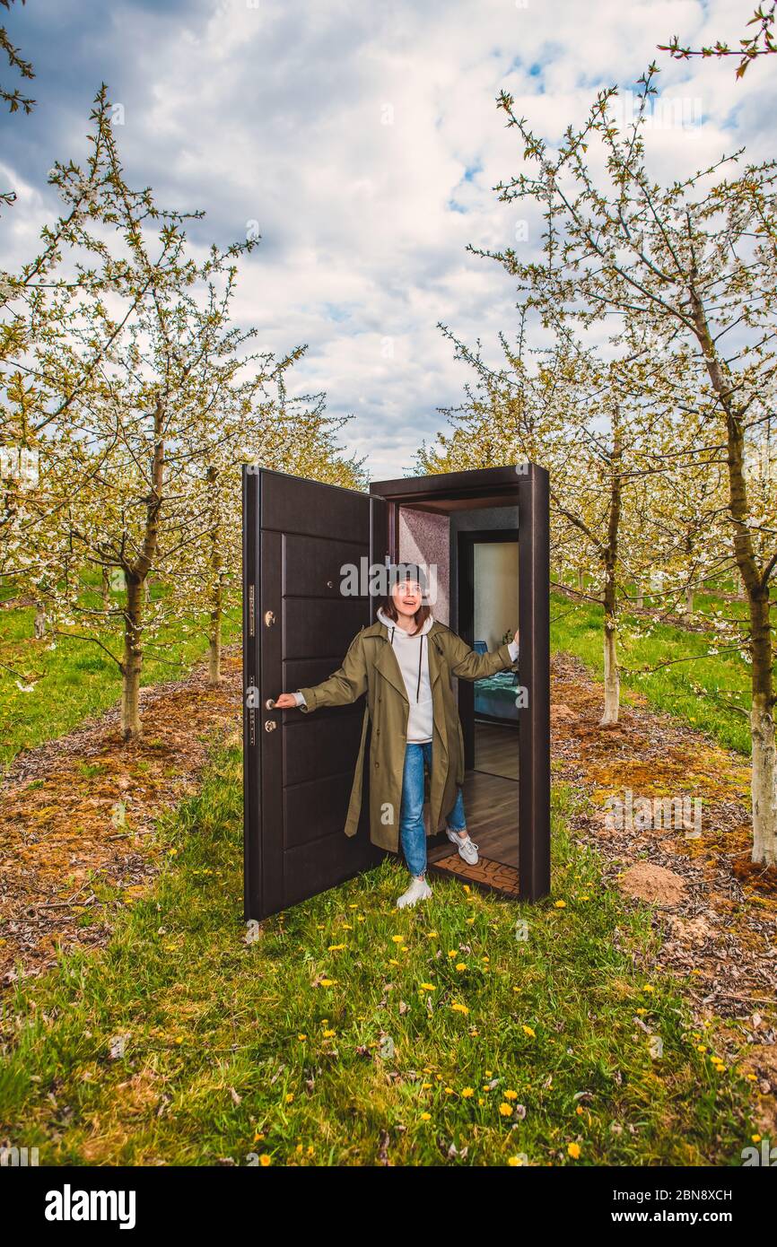 over of self isolation concept. woman opened out from home to garden ...