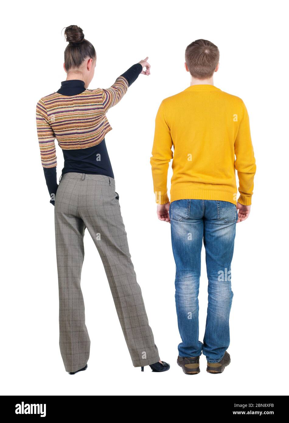 Back view of couple in sweater pointing. Rear view people collection ...