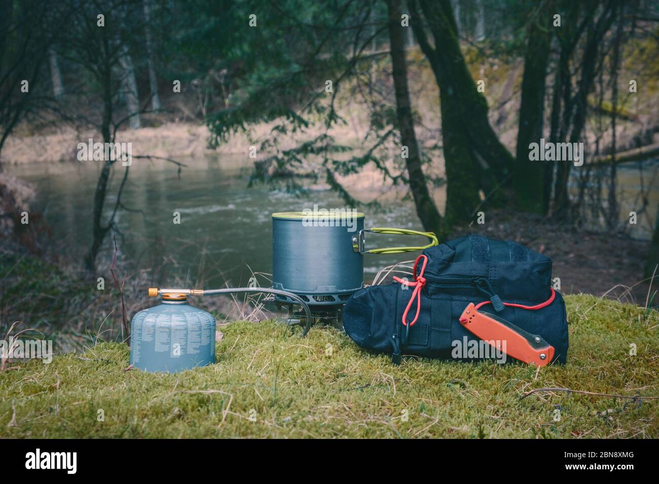 Cooking while hiking with a backpack Stock Photo - Alamy