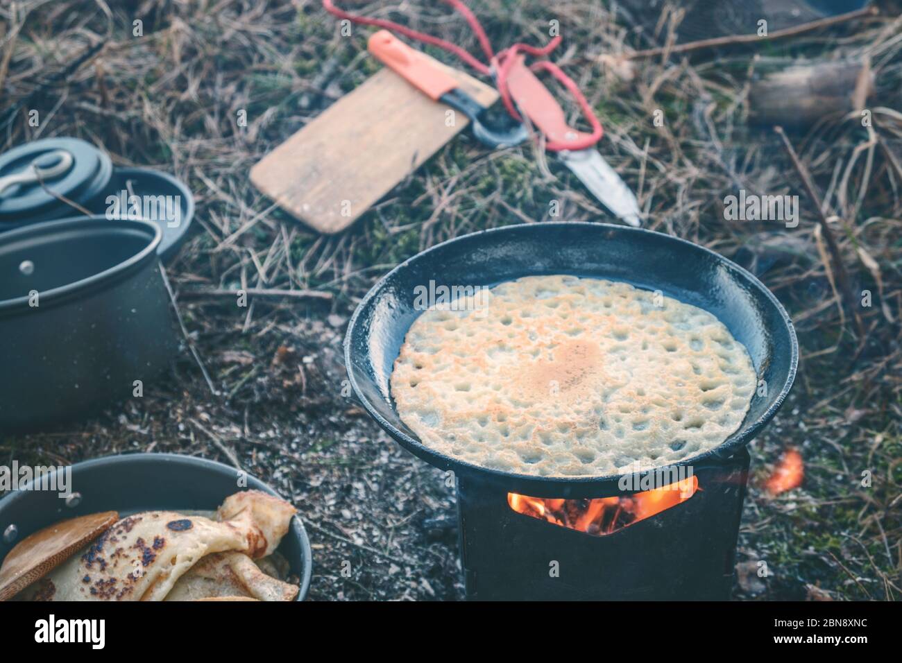 Cooking while hiking with a backpack Stock Photo - Alamy