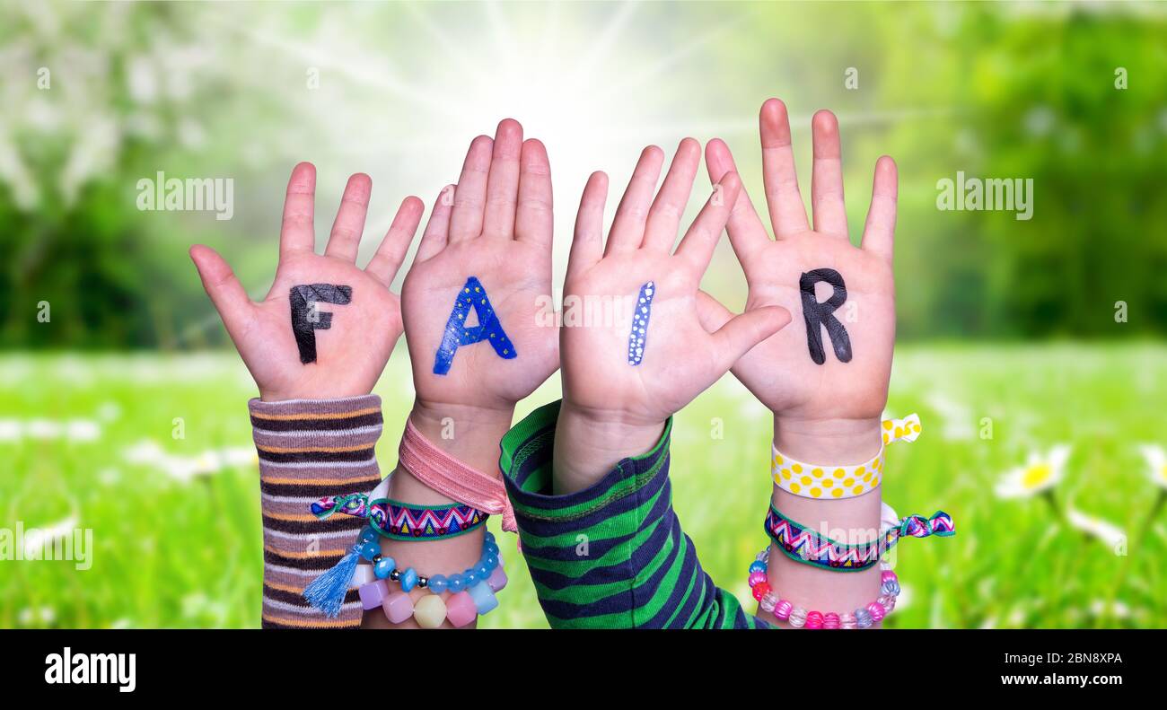 Children Hands Building Word Fair, Grass Meadow Stock Photo - Alamy