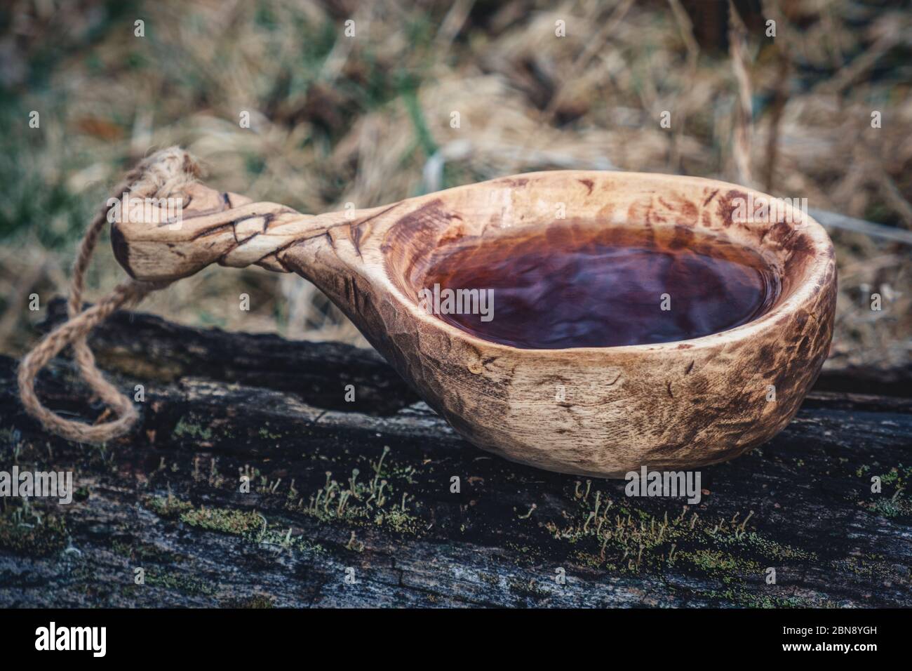 Wooden finnish cup (kuksa) with scenic background Stock Photo - Alamy