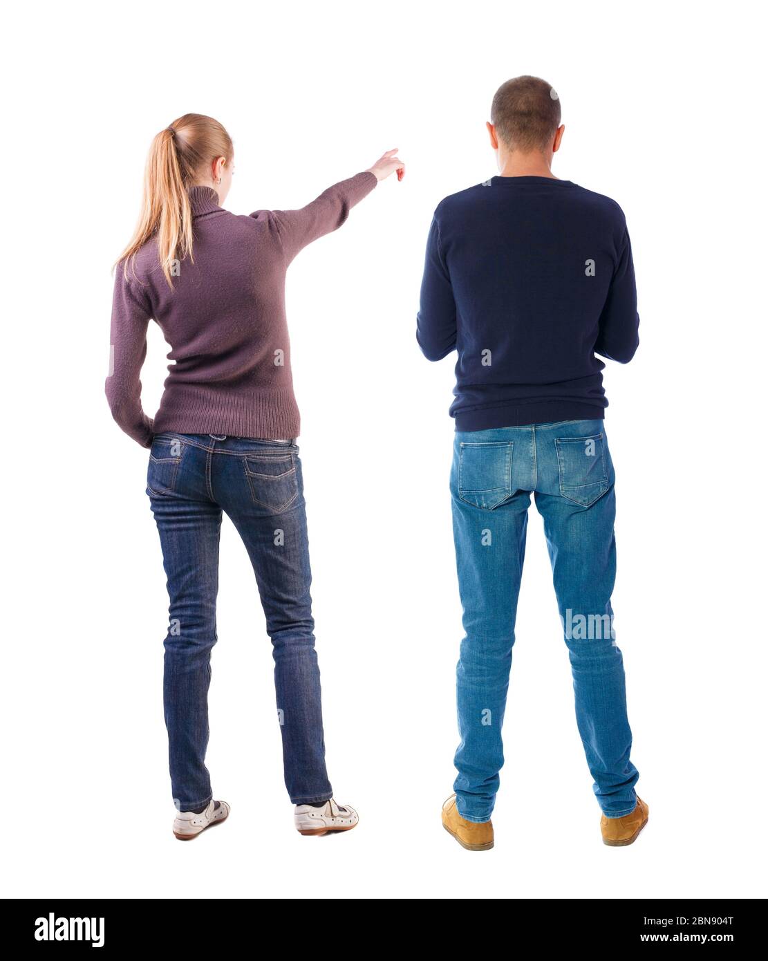 Back view of couple in sweater pointing. Rear view people collection ...