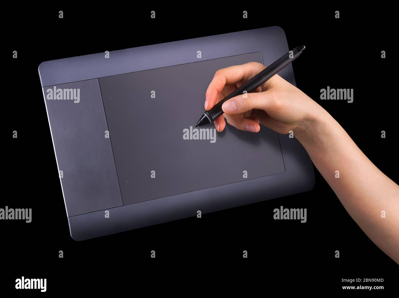 Hand holding digital graphic pen and drawing graphic tablet isolated on ...