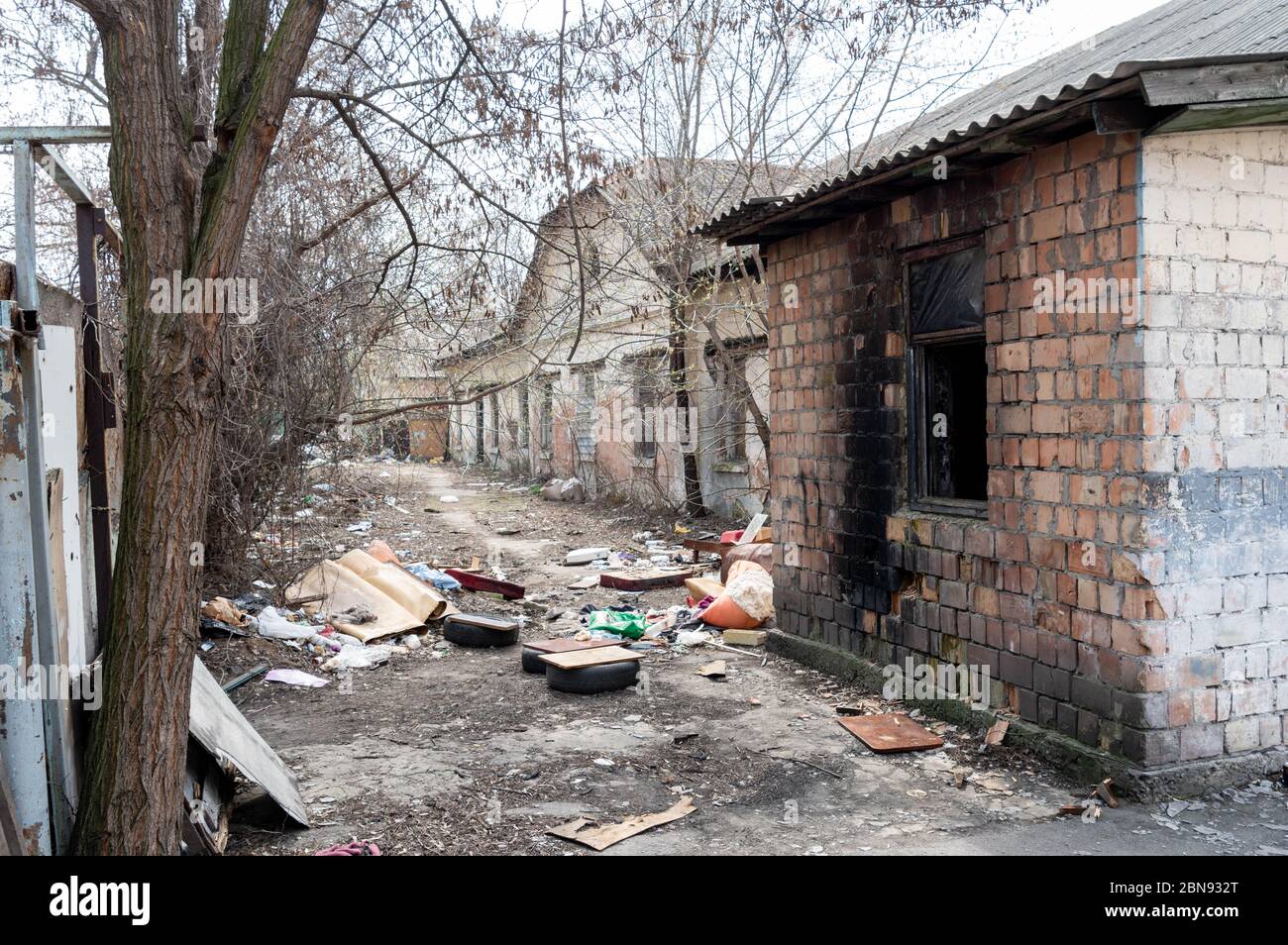 An old brick building with a fire. Industrial brick building. Dirty ...