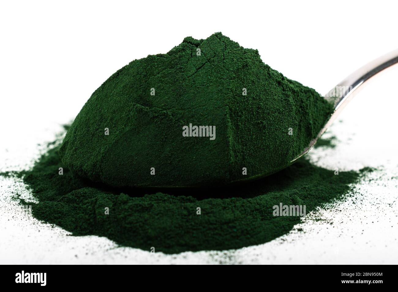 An isolated tablespoon of dried organic spirulina algae powder, on ...