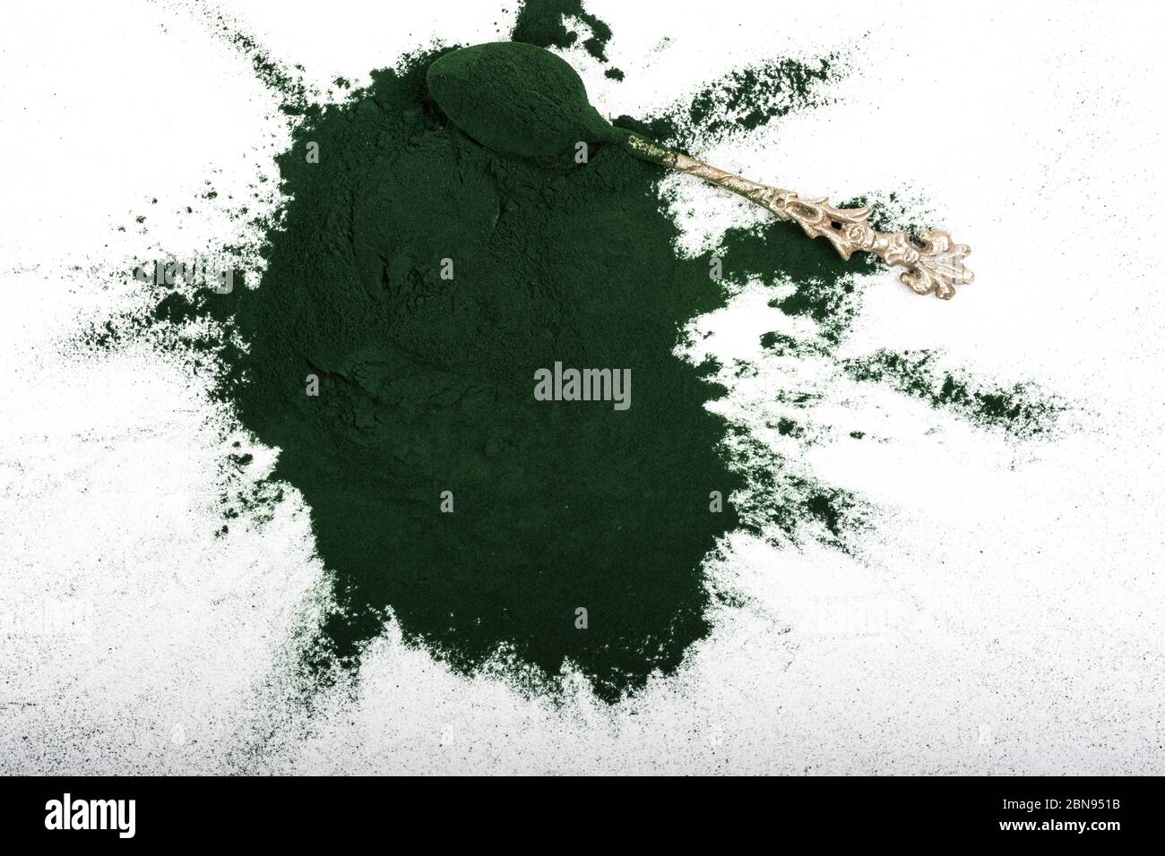 An isolated tablespoon of dried organic spirulina algae powder, on ...