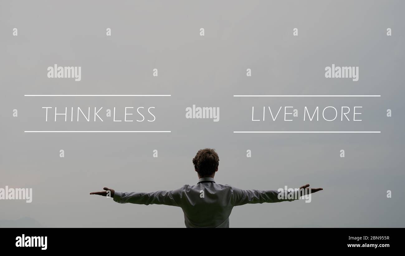 Think less live more sign over a businessman standing under grey sky ...