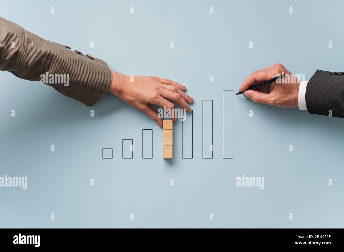 Hands growth building blocks hi-res stock photography and images - Alamy