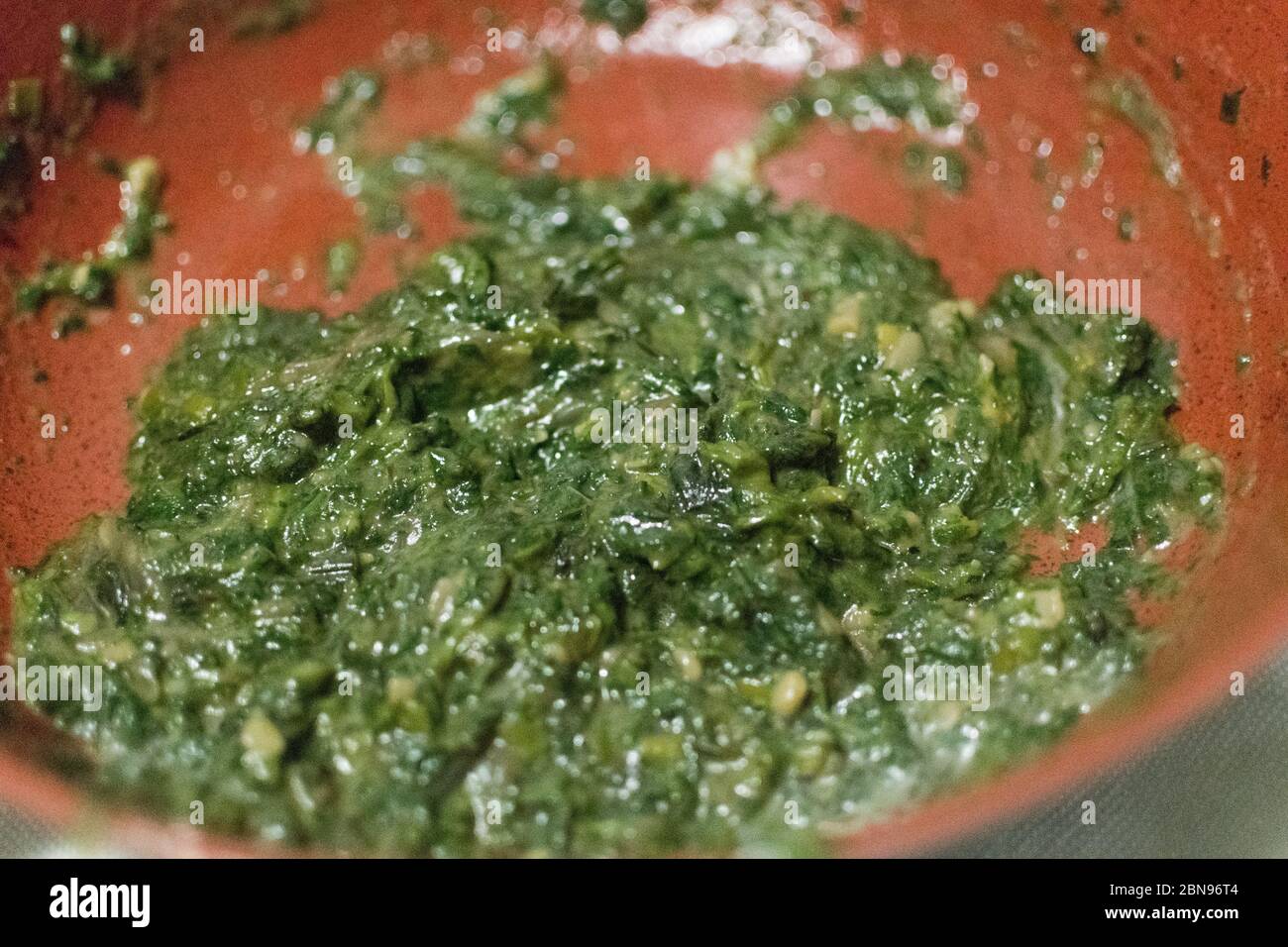 Nettle stew cooking in the pot. Close up view Stock Photo - Alamy