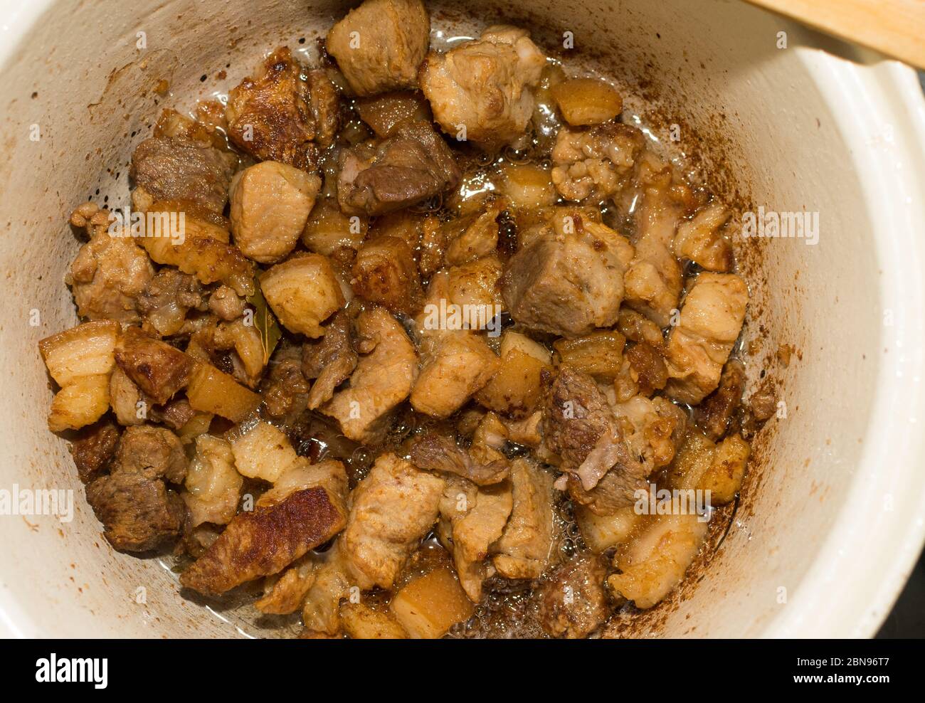 Delicious unhealthy fried pork greaves in the pan traditional Romanian ...