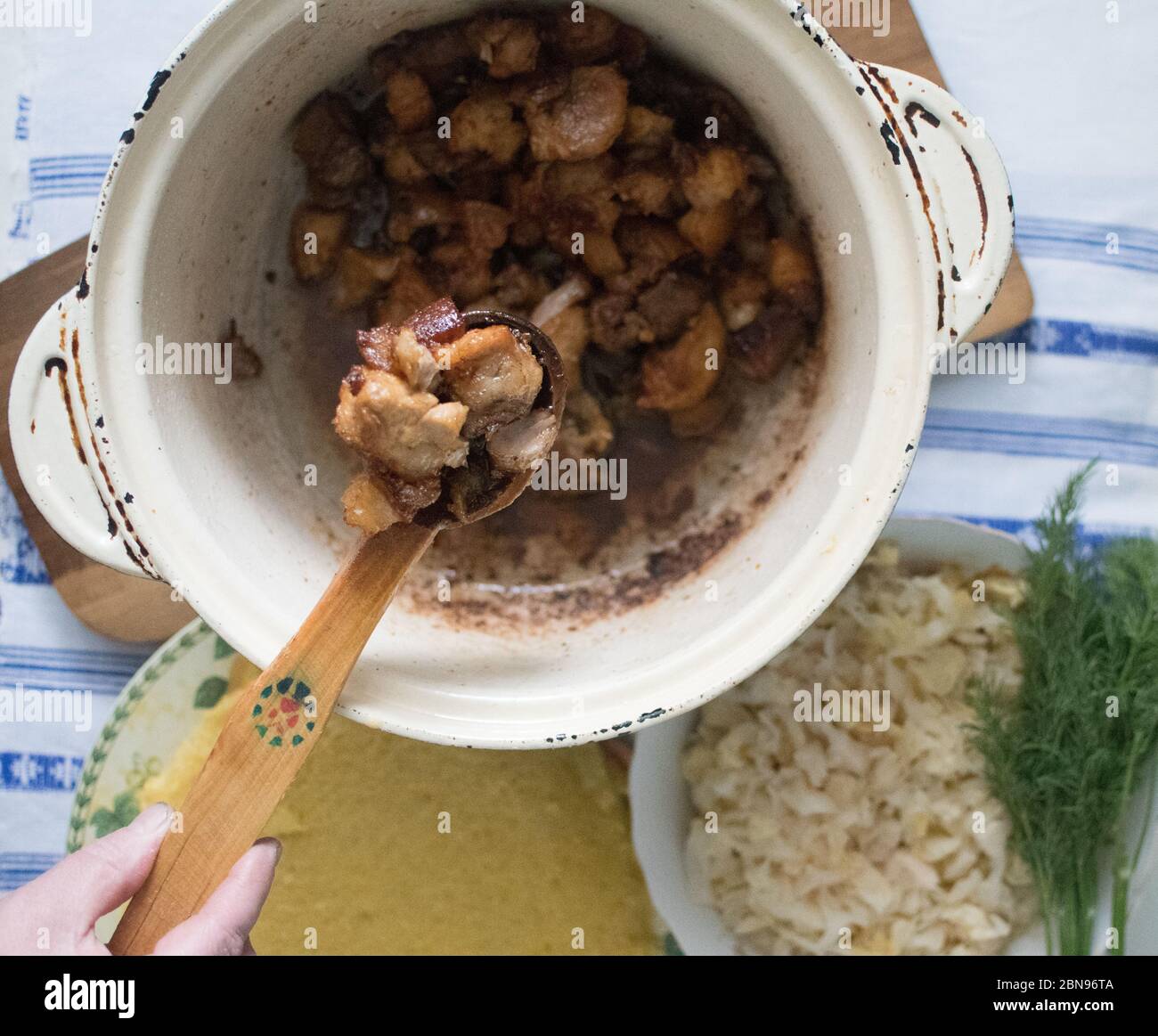 Delicious unhealthy fried pork greaves in the pan traditional Romanian ...