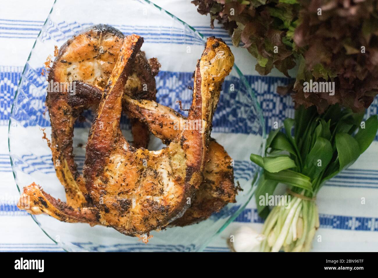 Freshly grilled fish on kitchen table. closeup and top view Stock Photo ...