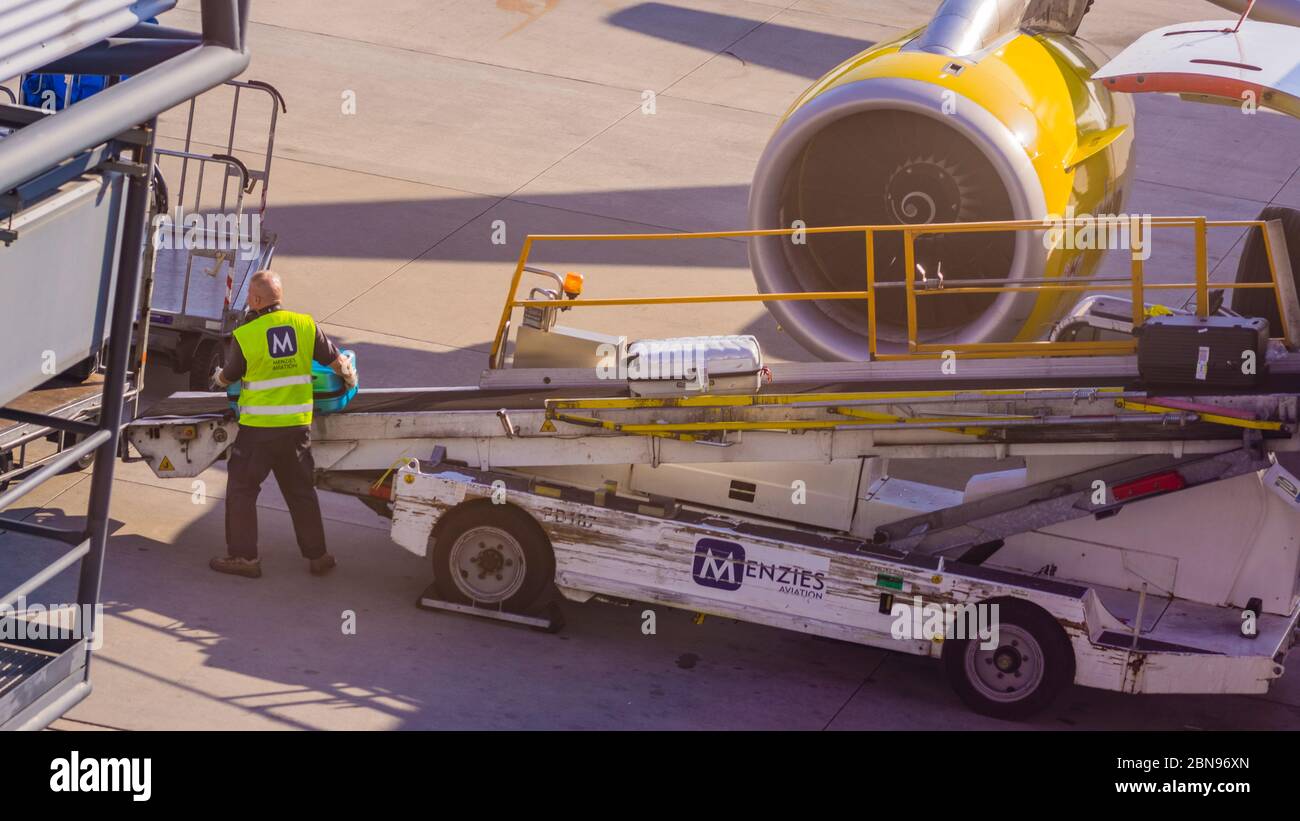 Aircraft being loaded at an airport on a day Stock Photo - Alamy
