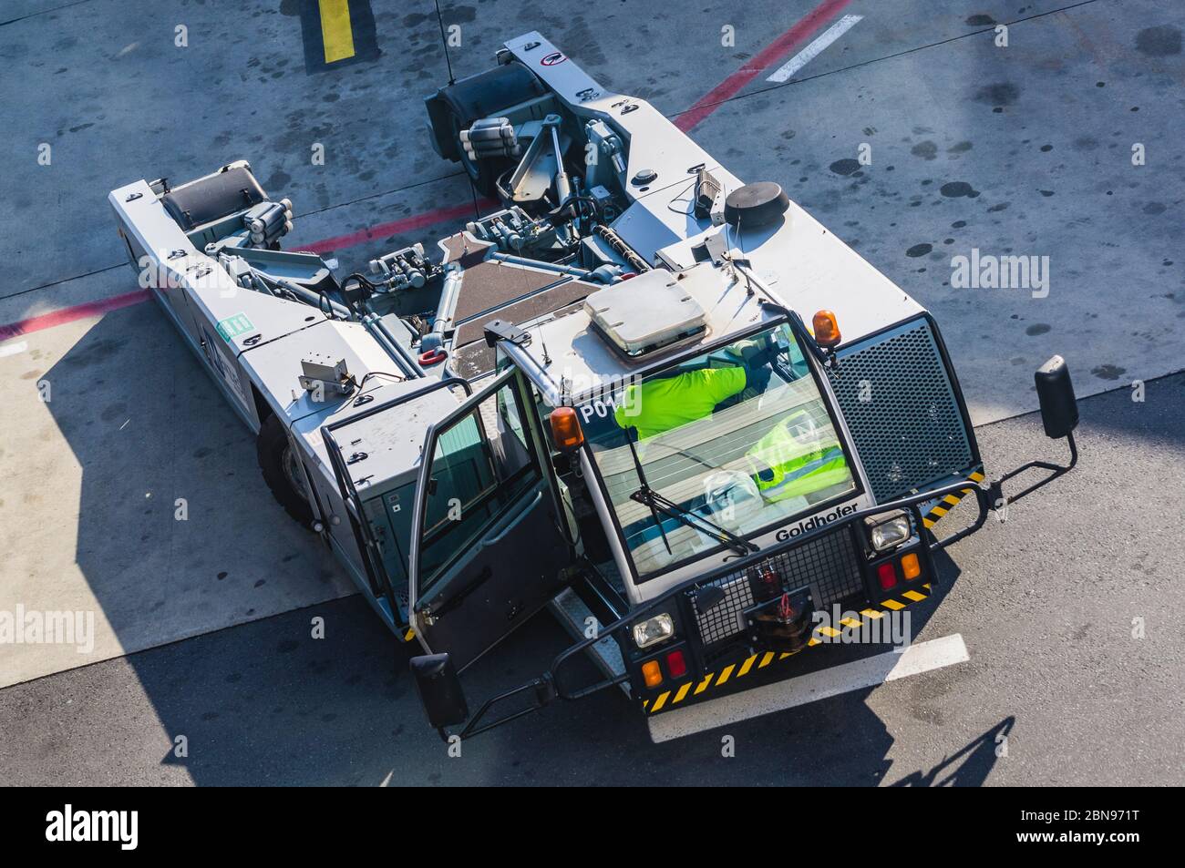 Aircraft being loaded at an airport on a day Stock Photo - Alamy
