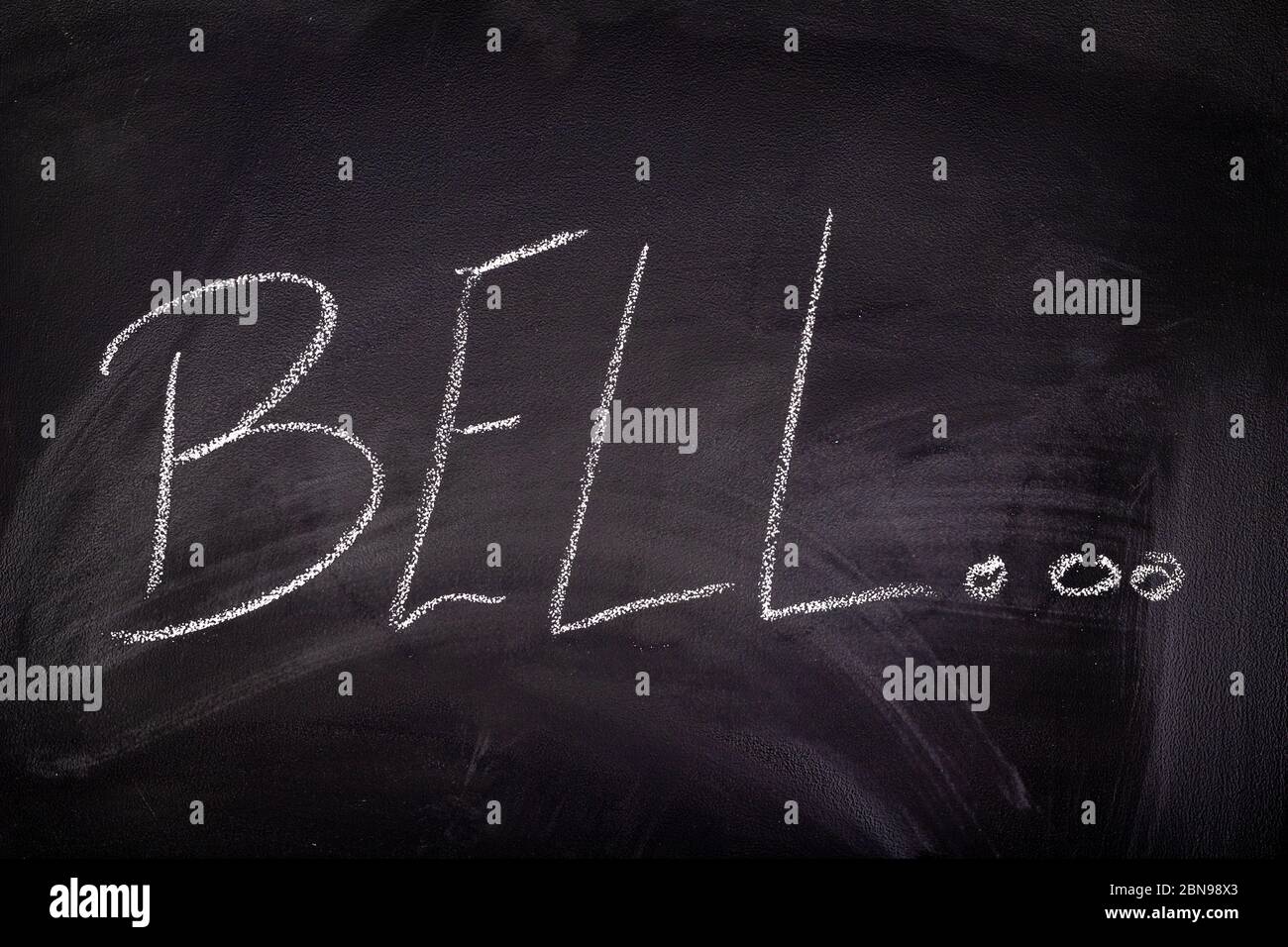 The inscription "bell..." on the school blackboard. White letters on a ...