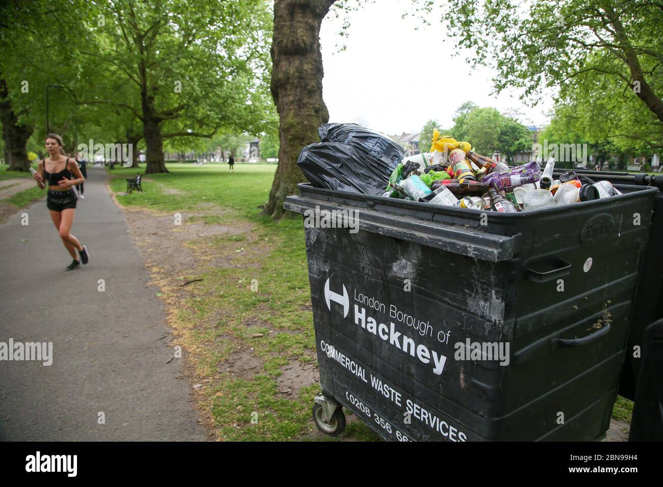 London, UK. 10th May, 2020. An overflowing bin in London Fields ...