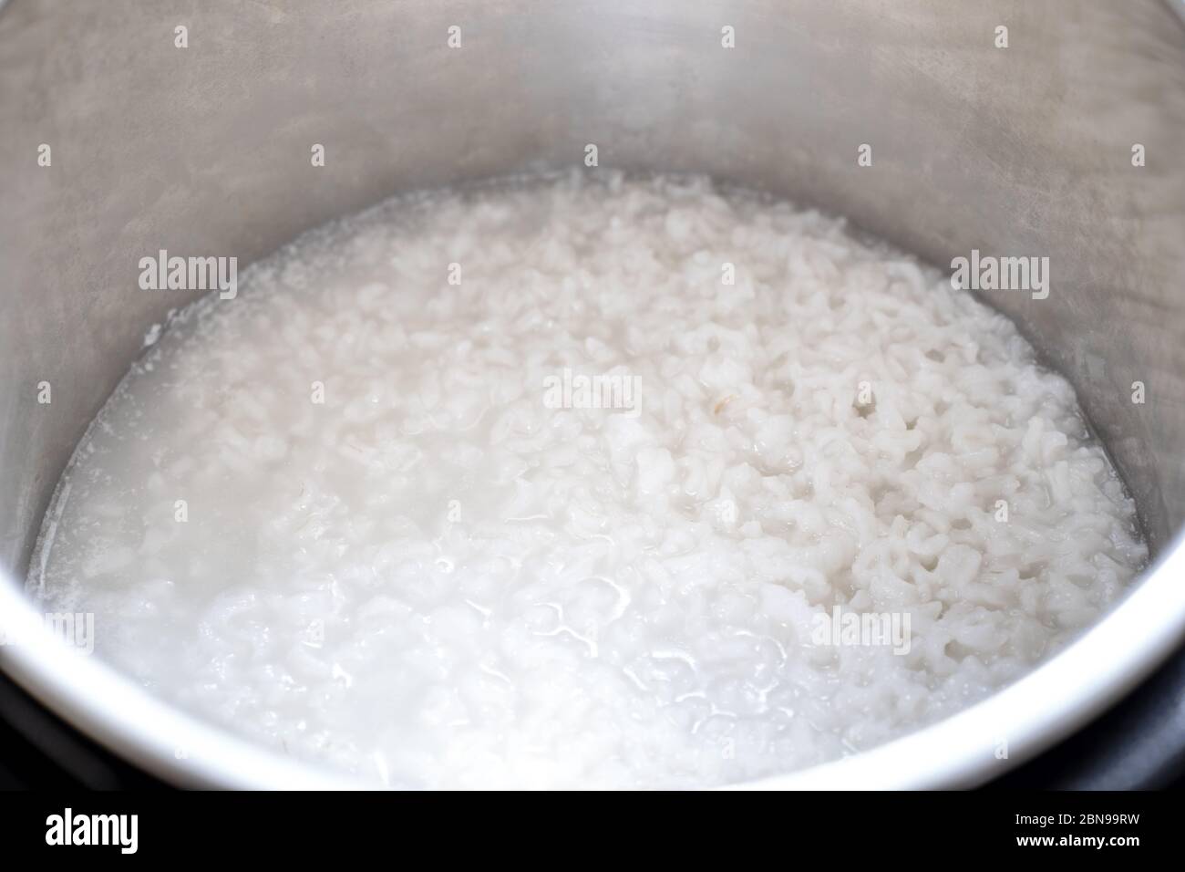 Rice porridge or congee in stainless steel pot Stock Photo - Alamy