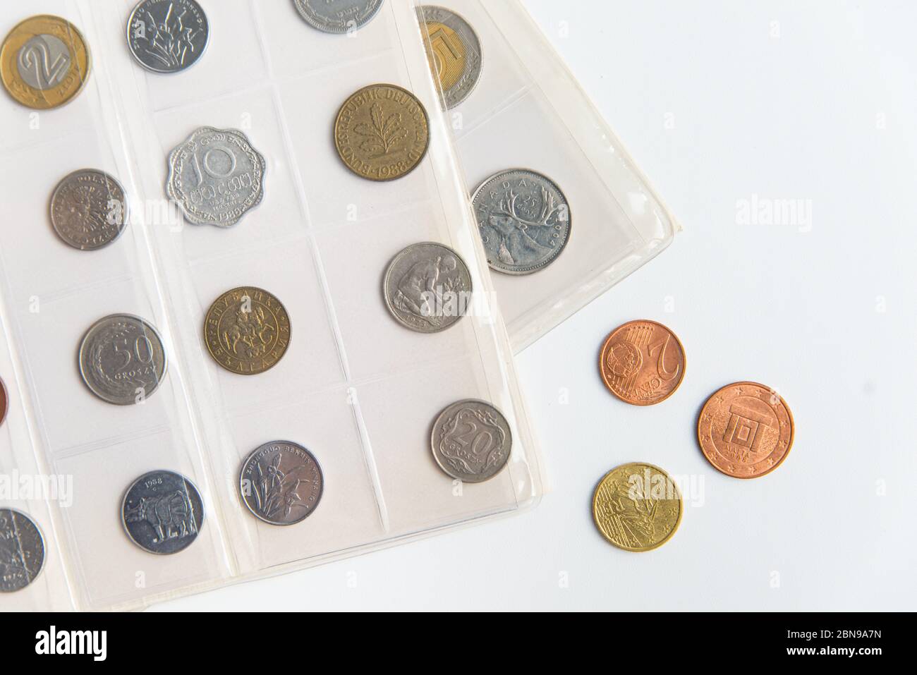 Flat lay of the numismatic album sheets and coins. Collection of ...