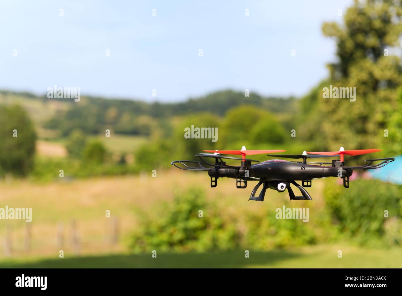 Flying drone with camera in air Stock Photo - Alamy