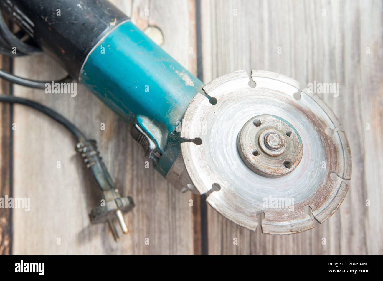 Old circular saw laying on the wooden background. Flat lay view of the ...