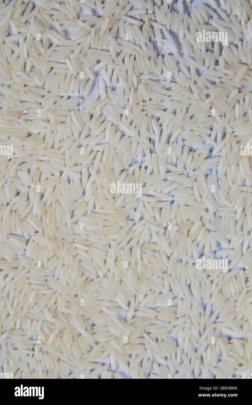 Top view of white rice seed texture background Stock Photo - Alamy