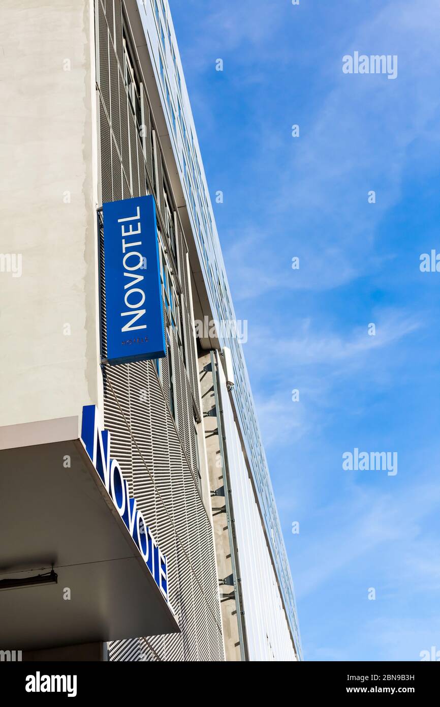 Novotel logo at hotel building located in Lyon, France on bright blue ...