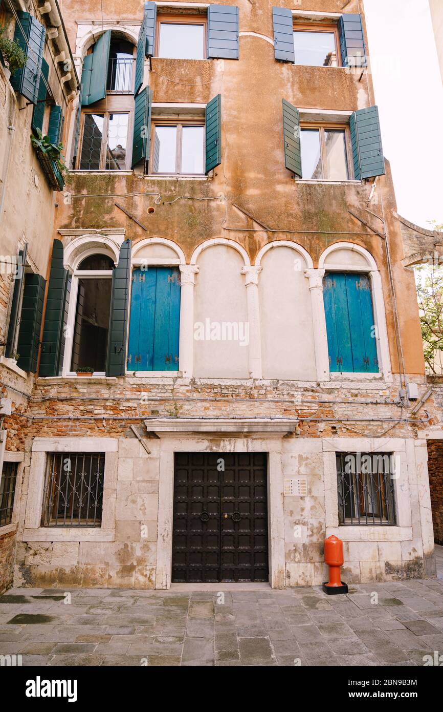 Close-ups of building facades in Venice, Italy. The facade of a five ...