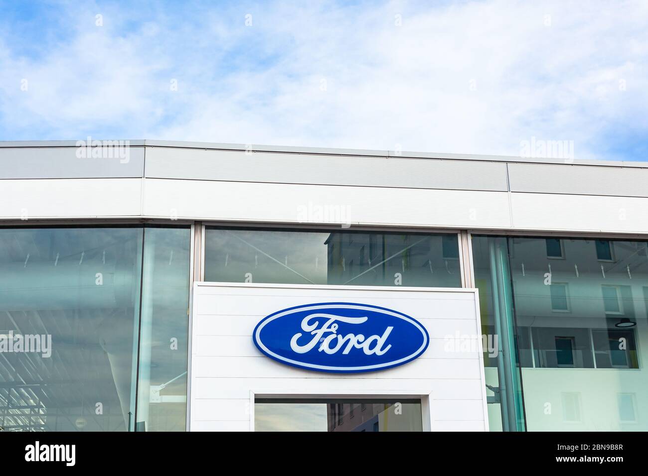 Ford Motor Company brand logo on bright blue sky background located on ...