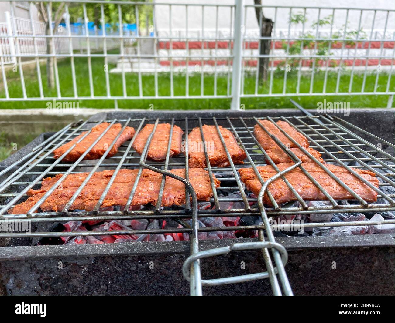Delicious Grilled meat on barbecue - Turkish Sausage "Sucuk" on the ...
