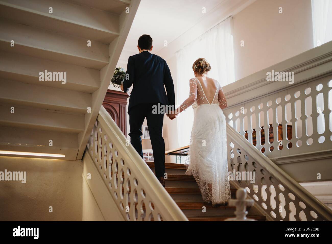 Couple going upstairs hi-res stock photography and images - Alamy