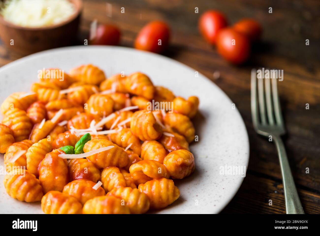Gnocchi with tomato sauce, basil, and cheese, traditional Italian pasta ...