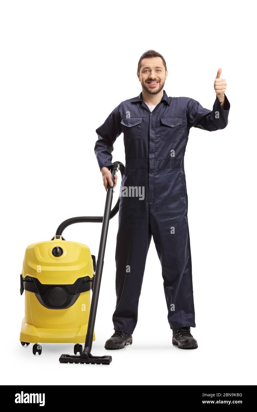 Full length portrait of a male cleaner in a uniform with a vacuum ...