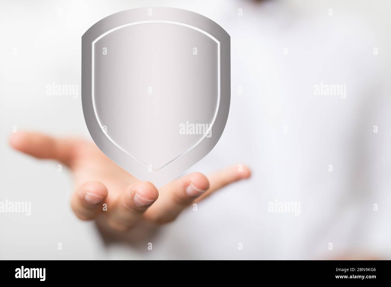A shield protection concept holding in hand 3d Stock Photo - Alamy