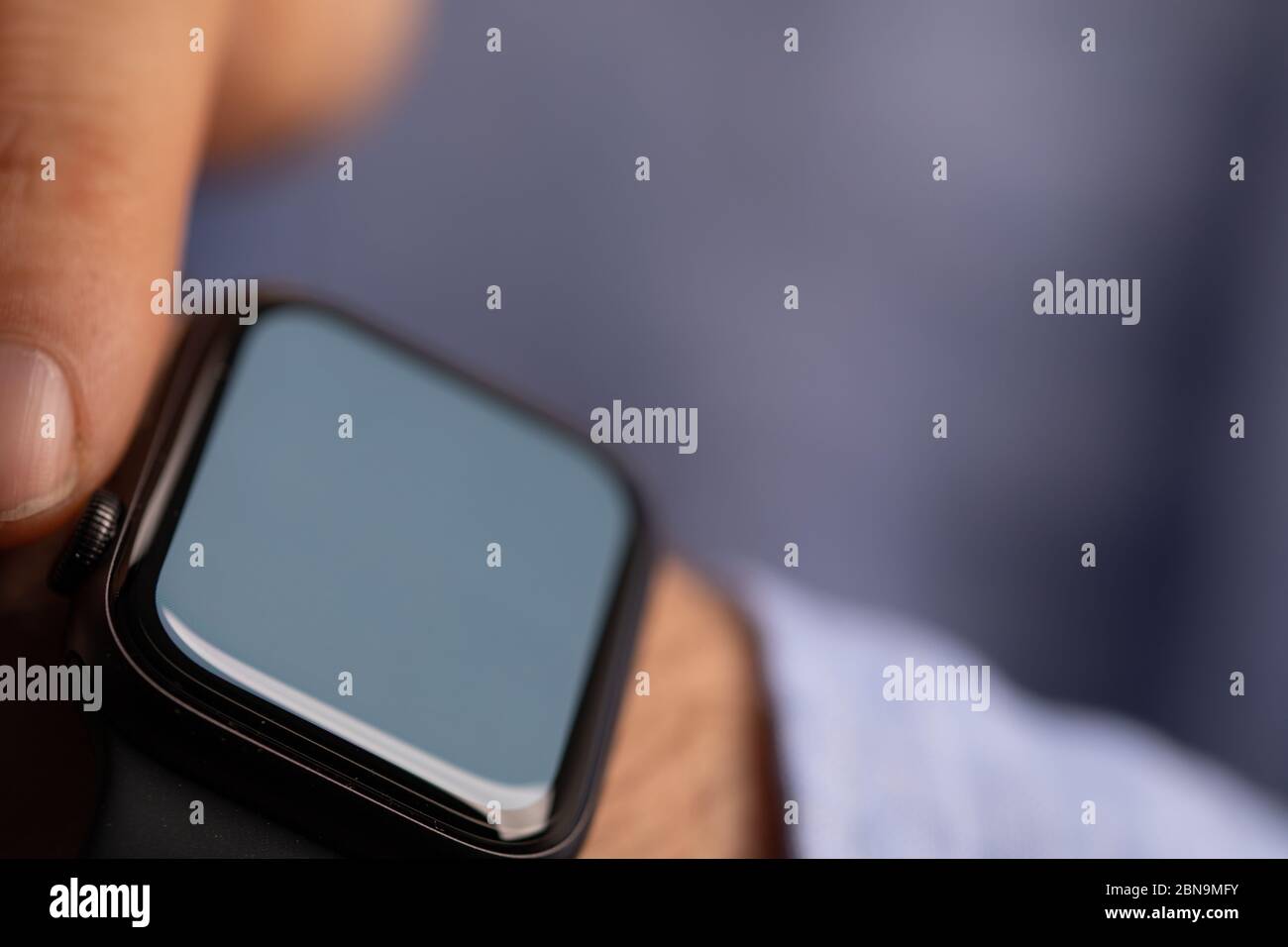 A Close up of Businessman's hand looking at hand watch Stock Photo - Alamy